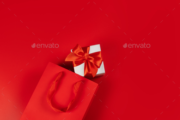 Bright packaging for purchases, gifts and parcels on a red background ...