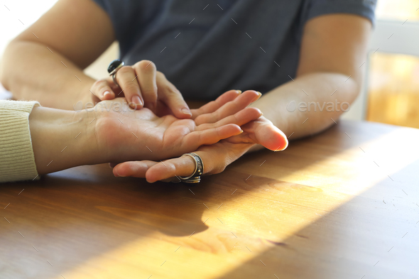 Woman visiting palmistry expert, fortune teller reading future ...