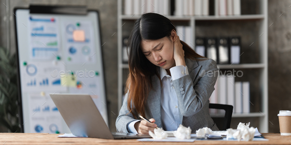 Stressed Asian business woman worry about marketing plan of this years ...