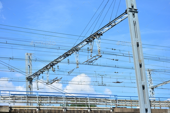 Electric wires on the railway for high-speed trains Stock Photo by o1559kip