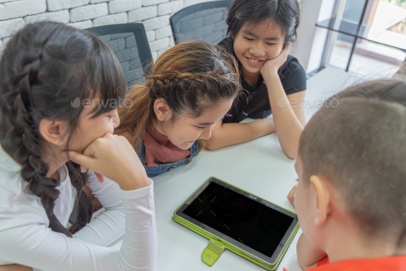 Elementary school students chatting during their lunch break in the ...