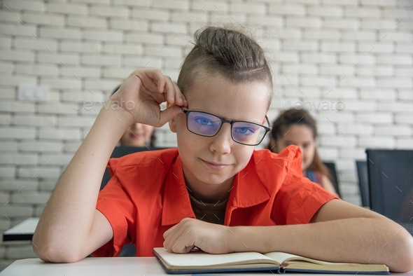male high school students wearing glasses are happy to come to school ...