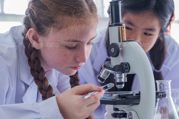 group children study science subjects and use Microscope Stock Photo by ...