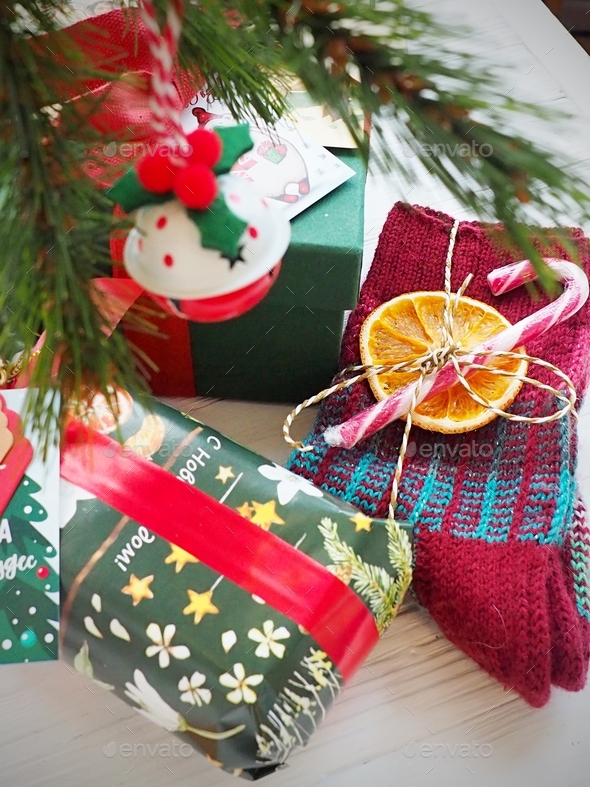 Packed gifts under a Christmas tree on a white wooden floor Stock Photo ...