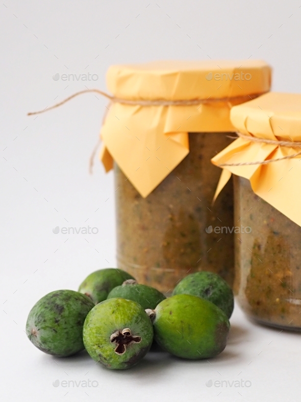 Feijoa fruits and homemade feijoa jam in glass jars on a white background Stock Photo by ...