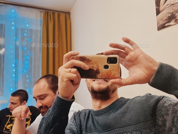 Man snapping photo with smartphone Stock Photo by romadope | PhotoDune