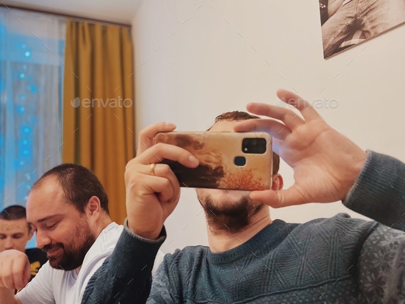 Man snapping photo with smartphone Stock Photo by romadope | PhotoDune