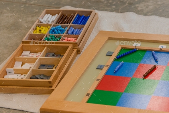 Montessori multiplication board. Concrete math. Stock Photo by Janno86