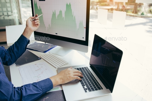 Investors are using laptops entering investment websites stocks market ...