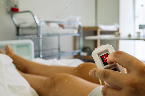 View of patient press red emergency button to calling nurse for help in ...