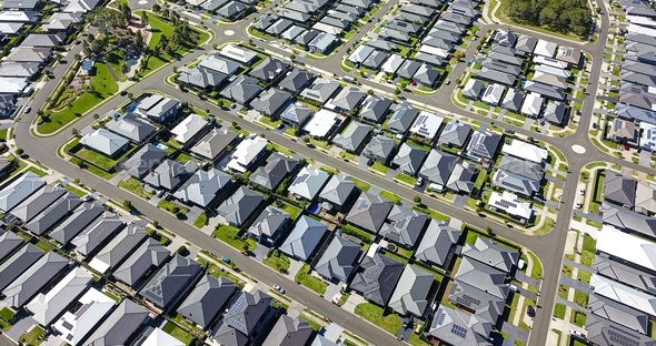 An aerial view of a new housing estate in the suburbs. Urban sprawl ...