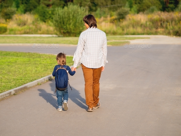 Father takes his son to school. Back to school after summer holidays ...