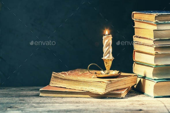 Dark Academia study at night background with old books stacked and ...