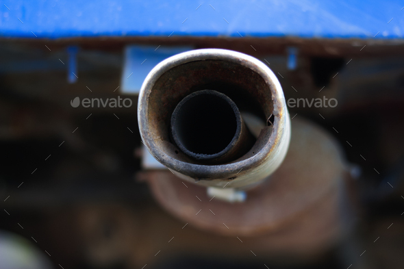 old muffler expire. Rust on muffler exhaust pipe system. The concept of ...