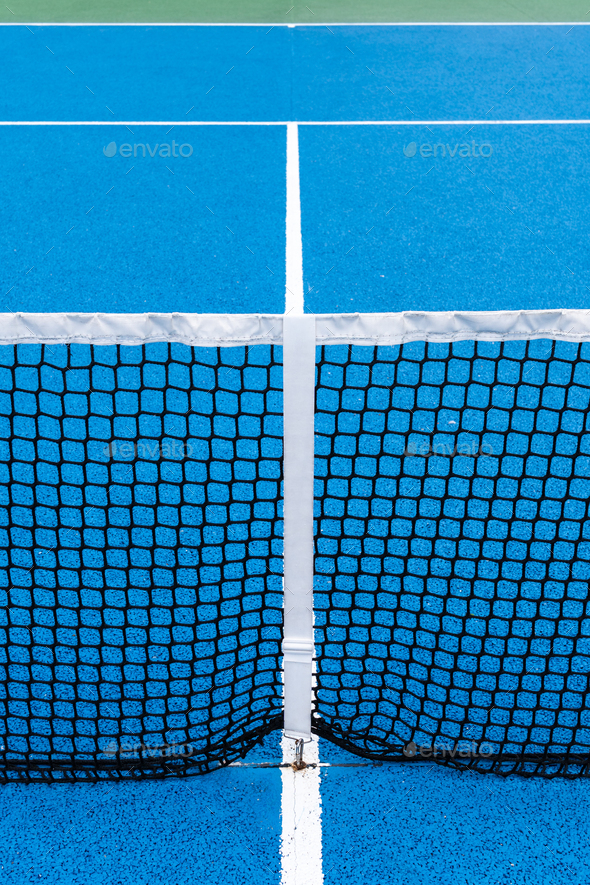 Detail of a Blue Tennis court with black net Stock Photo by fotodestock