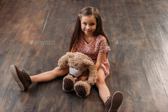beautiful little child sitting on floor with teddy bear Stock Photo by ...