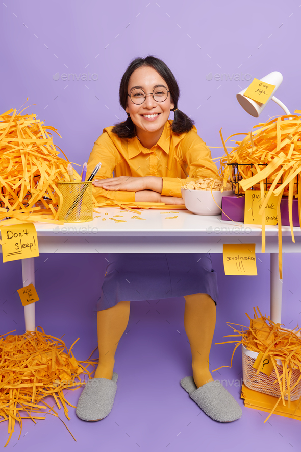 Skilled female student works on creative university course work sits ...