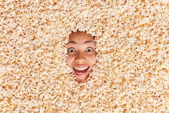 Horizontal shot of cheerful impressed greatly surprised female model ...