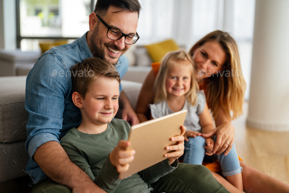 Device technology family online education concept. Happy family with ...