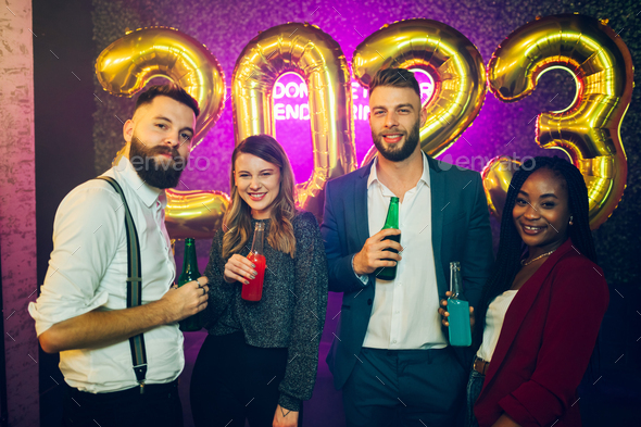Multiracial people celebrating new years eve in the club Stock Photo by ...