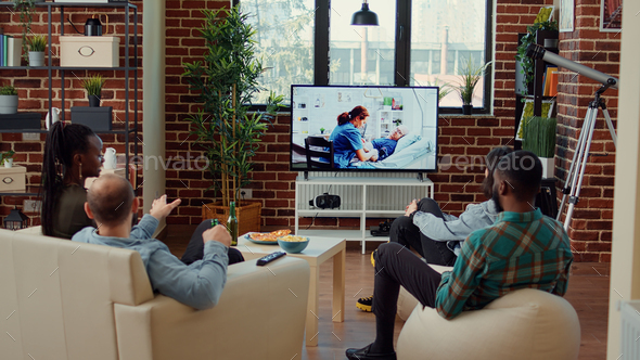 Cheerful people watching drama tv series on television Stock Photo by ...