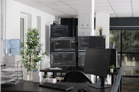 Pc desk with multiple monitors running terminal window Stock Photo by ...