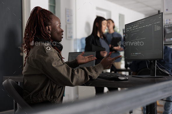 African american system engineer working on html code development Stock Photo by DC_Studio