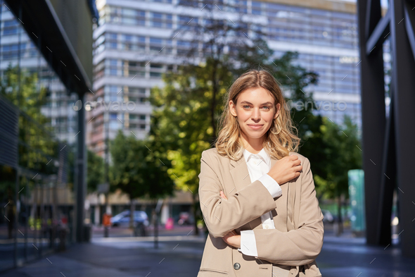 Stylish corporate woman, young lady boss in suit, looking confident and ...