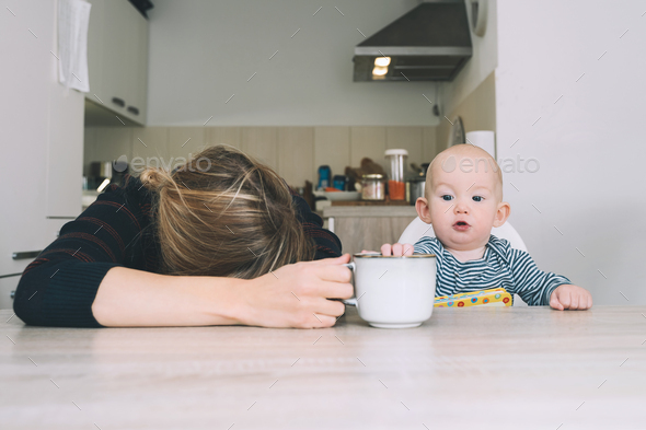 Modern tired mother and little child after sleepless night. Stock Photo ...