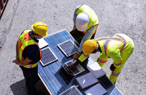 3 engineer working in clean solar energy industry talking about the ...