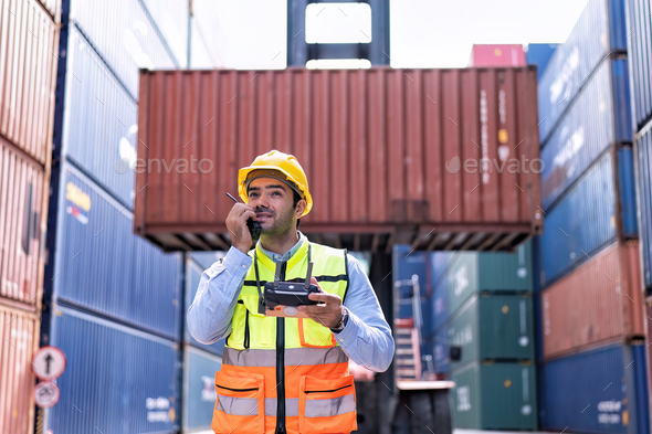 Engineer working in container storage yard fly drone looking location ...