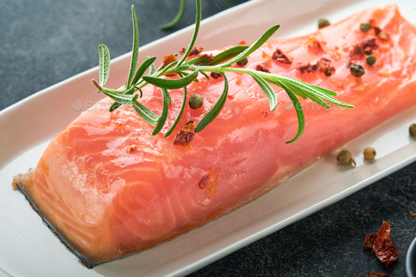 Salmon fish piece. Fresh raw salmon fish piece on marble board stand ...