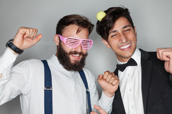 Classy smiling multiracial men clubbing and dancing Stock Photo by kegfire