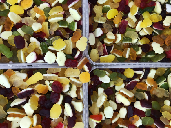 Multi-Colored Different Shapes Rubber Candies in Plastic Boxes Stock ...