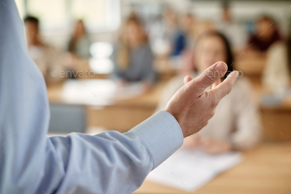 Close-up of teacher giving lecture in the classroom. Stock Photo by ...