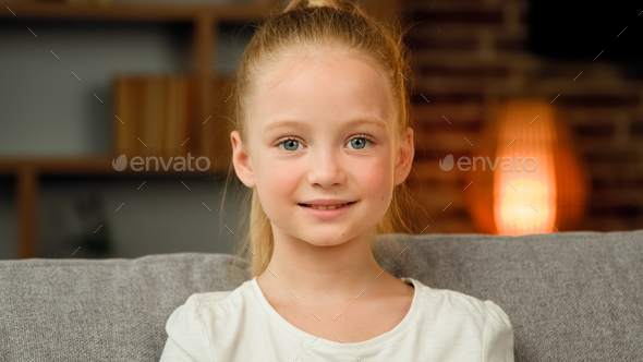 Cute girl small child caucasian baby looking at camera portrait ...