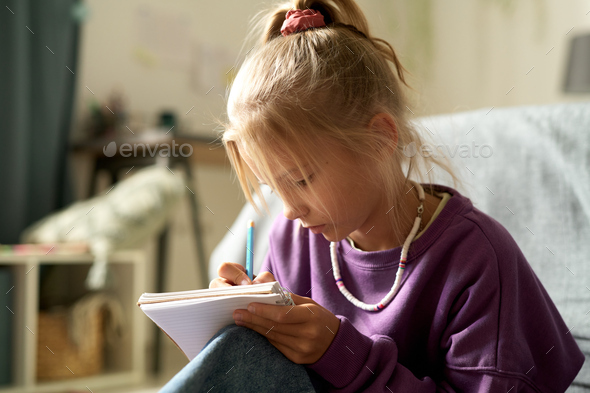 Little girl writing in her diary Stock Photo by Media_photos | PhotoDune