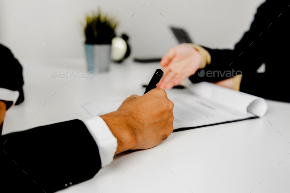 Close up hand sign, Bank agency explain and employee signing contract ...