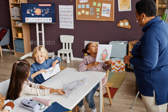 Cute little learner of primary school boasting with her drawing Stock ...
