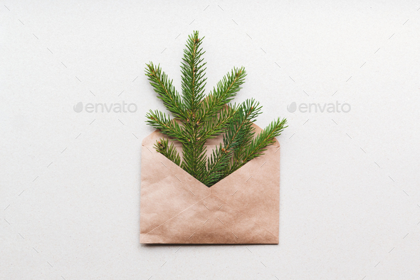 Christmas tree in paper envelope recycled cardboard background plastic ...