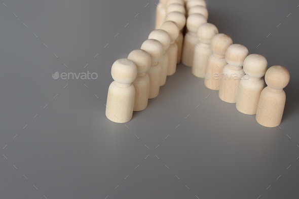 Group of people figures divide into two. Stock Photo by mohdizzuanbinroslan