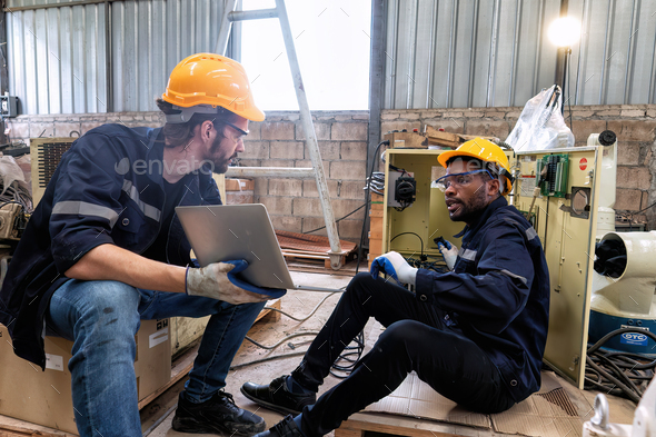 In robotic repair shop engineer troubleshoot repair electrical ...