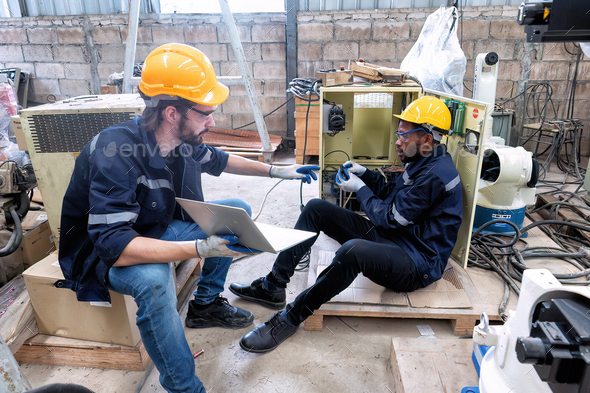 In robotic repair shop engineer troubleshoot repair electrical ...