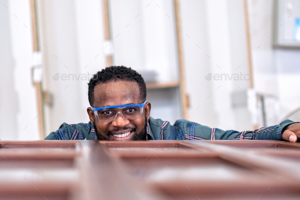In work place carpenter man concentrate on ruler pencil draw alignment ...