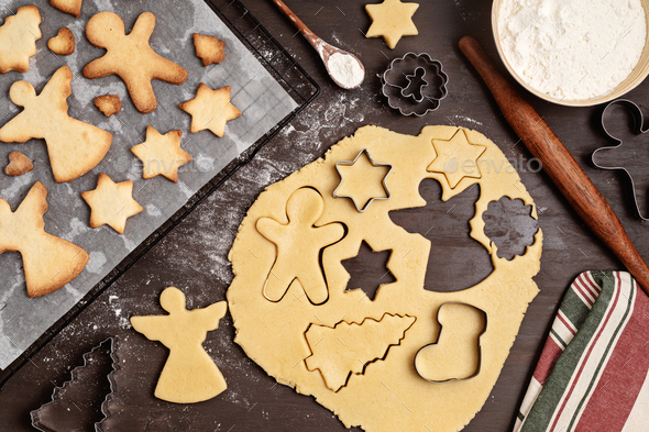 Christmas cookies baking process. Cutting buiscuits with cookies cutter ...