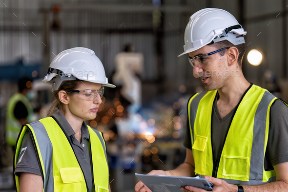 In robotic maintenance shop engineer busy commissioning and operate ...