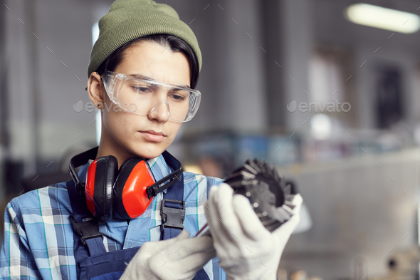 Hipster girl watching milling machine tool Stock Photo by Media_photos