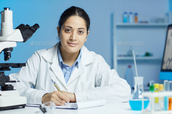 Indian female intern in laboratory Stock Photo by Media_photos | PhotoDune