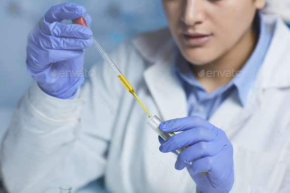 Mixing reagents into test tube of medical sample Stock Photo by Media ...