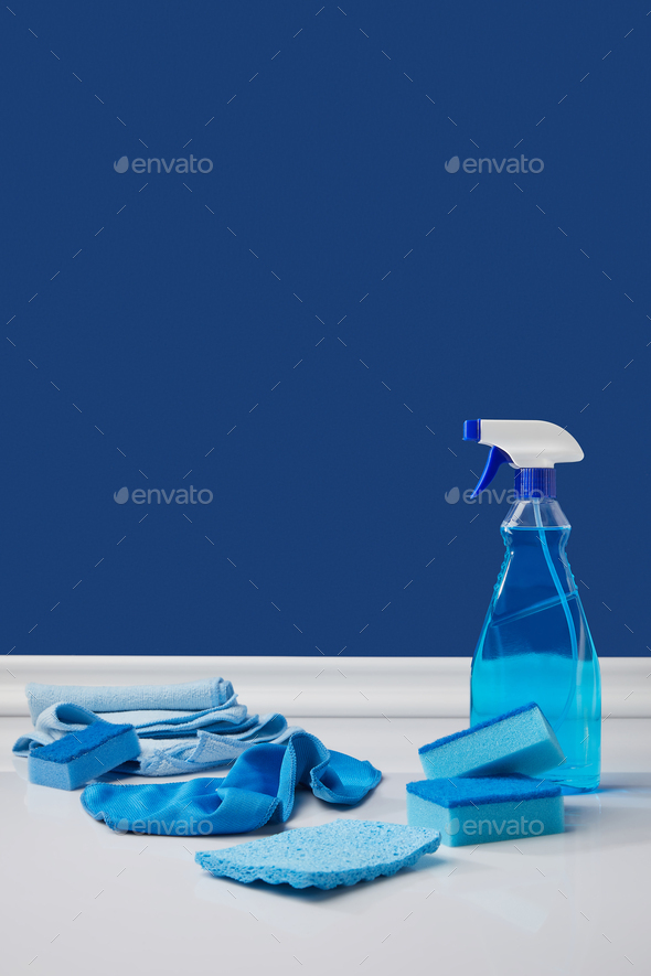 blue spray, rags and washing sponges for spring cleaning Stock Photo by ...
